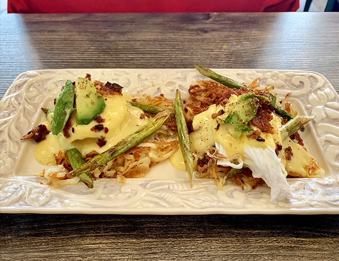 The legendary Bird's Nest—where hash browns, asparagus, and poached eggs unite under hollandaise in perfect harmony.