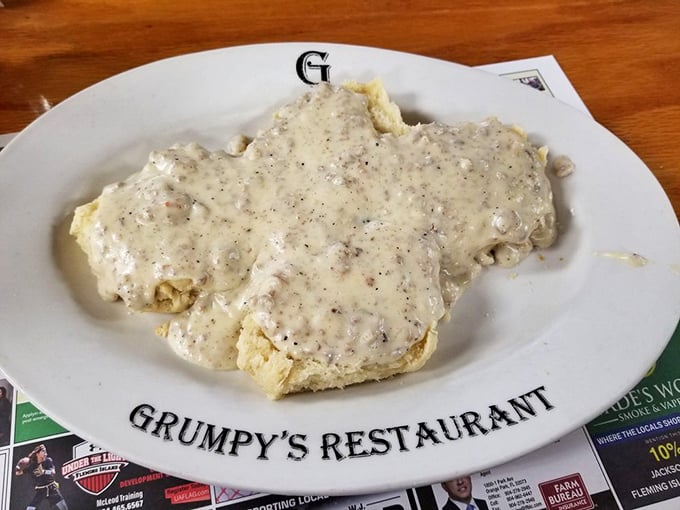 The legendary biscuits and gravy—where peppery, sausage-studded cream gravy blankets fluffy biscuits in a comfort food masterpiece that haunts dreams.