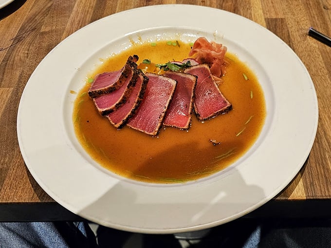 Blackened ahi sashimi swimming in a golden broth—proof that sometimes the best things in life are indeed rare.