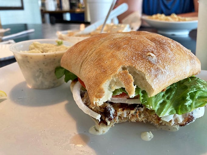 This blackened grouper sandwich isn't just lunch—it's a Florida rite of passage. The fish practically high-fives your taste buds with each perfectly seasoned bite.