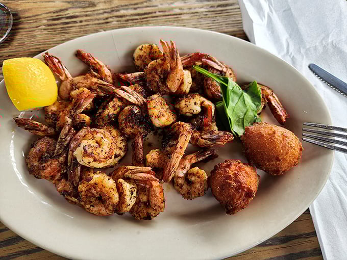 Georgia shrimp, blackened to perfection, arranged like they're posing for their seafood yearbook photo. The hushpuppy is just showing off.