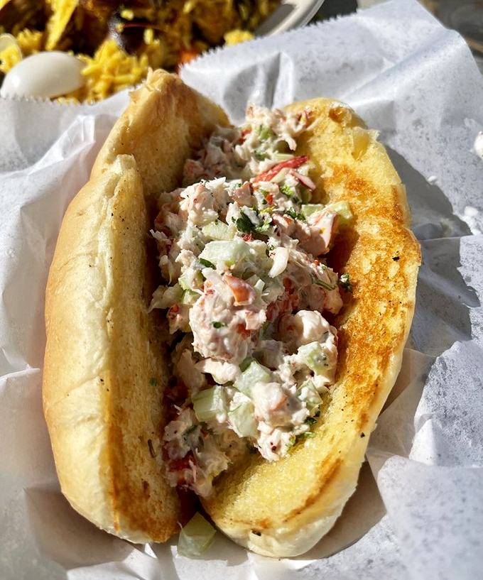 The Boardwalk Lobster Roll—where East Coast tradition meets West Coast sunshine. Sweet lobster chunks nestled in a perfectly toasted roll that would make a New Englander weep with joy.
