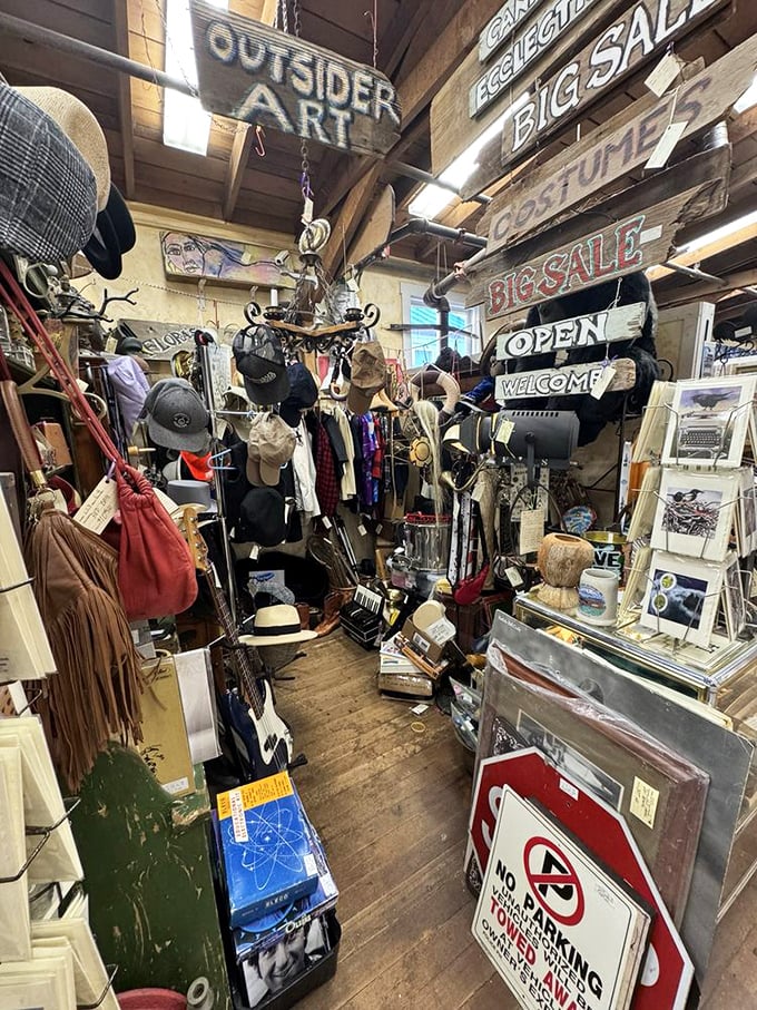 Every booth tells a different story—this one's clearly written by someone who never met an "OPEN" sign or vintage hat they didn't want to take home.