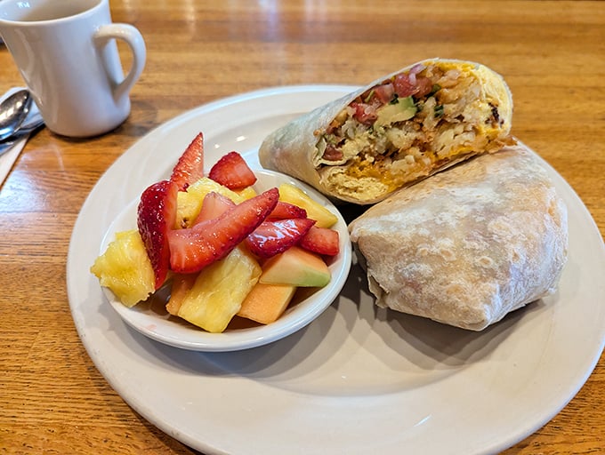 Breakfast doesn't get better than this hearty burrito alongside fresh fruit that's actually ripe – a California miracle worth celebrating.