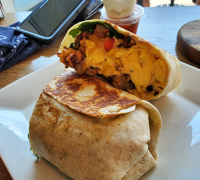 The breakfast burrito that launched a thousand return visits – golden-grilled, stuffed with eggs, potatoes and veggies that practically demand a photo.