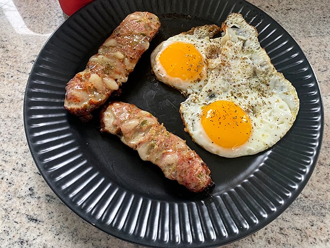 The breakfast of champions isn't some fancy avocado toast—it's this perfectly browned kielbasa alongside eggs, creating the morning duo that built America.