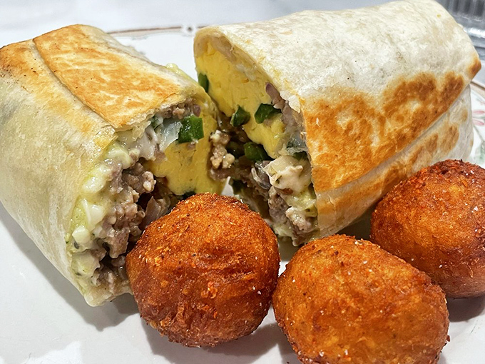 Behold the architectural marvel that is their breakfast burrito – where structural integrity meets flavor harmony, with crispy potato spheres standing guard.