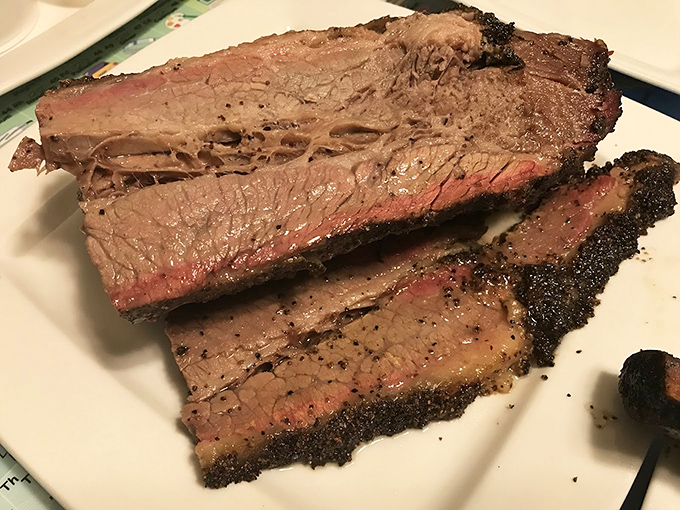 Brisket sliced to perfection – the barbecue equivalent of watching Michelangelo unveil David. That bark! That smoke ring! That jiggle!