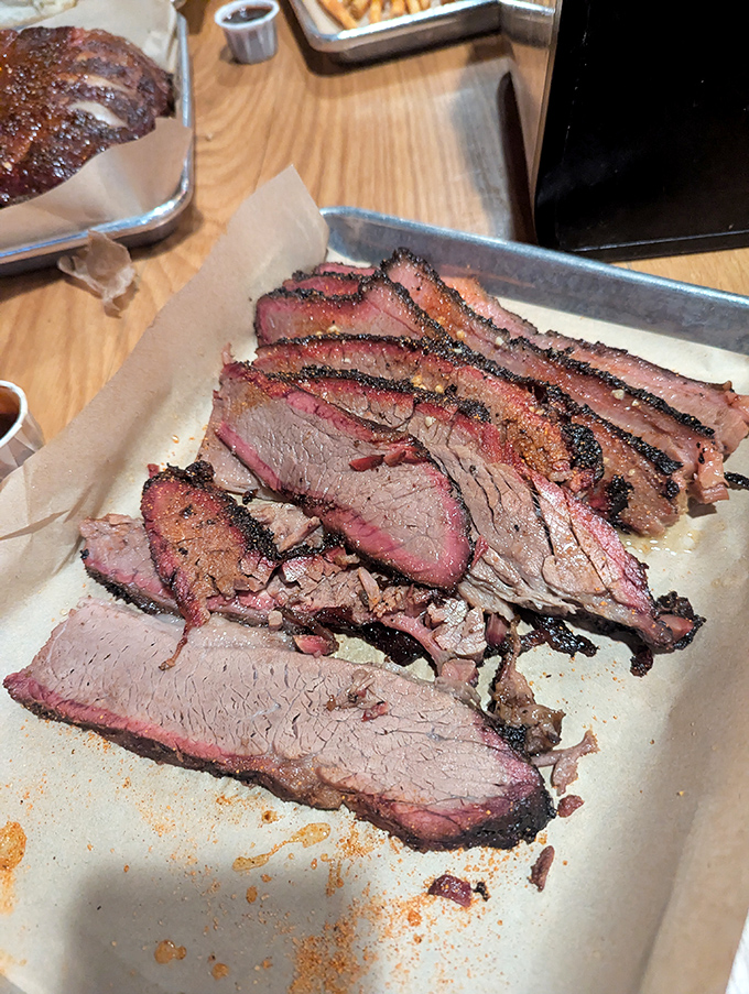Brisket with that coveted pink smoke ring isn't just meat—it's a time-intensive labor of love that rewards patience with pure carnivorous bliss.