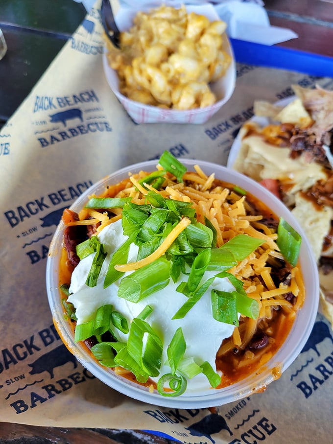 Brisket chili topped with green onions and sour cream—proof that leftover brisket isn't really leftover, just waiting for its second act.