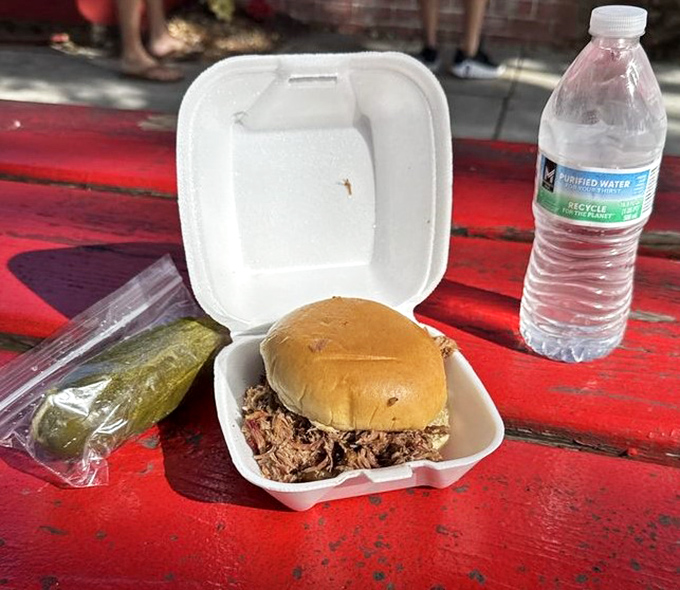 A humble sandwich that delivers an extraordinary experience. The pickle's not just a garnish—it's the perfect acidic counterpoint to smoky richness.