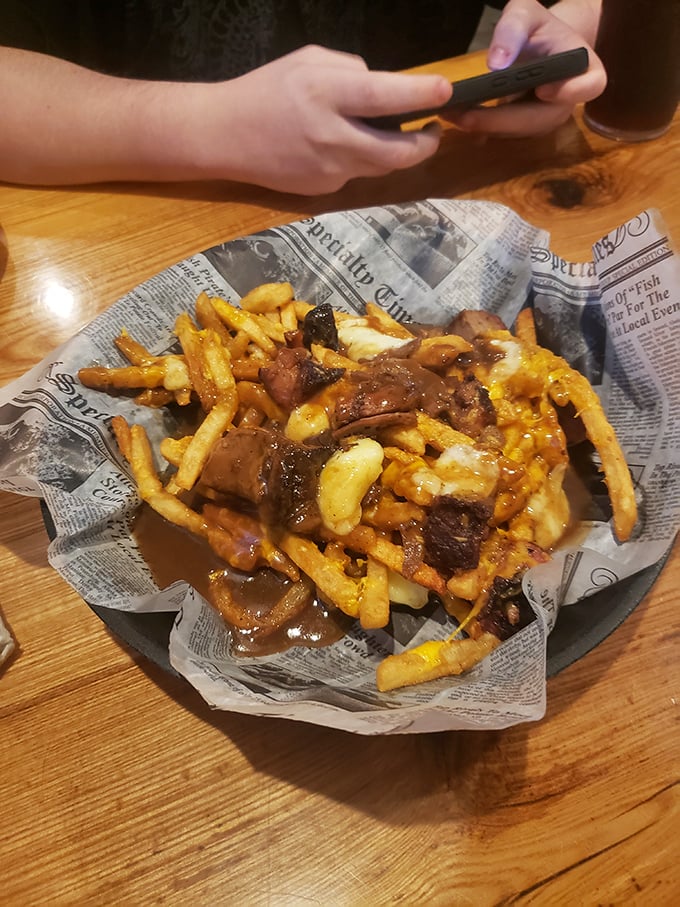 Poutine gets the brisket treatment! Golden fries swimming in gravy with chunks of that famous smoked meat—a beautiful mess worth every napkin.