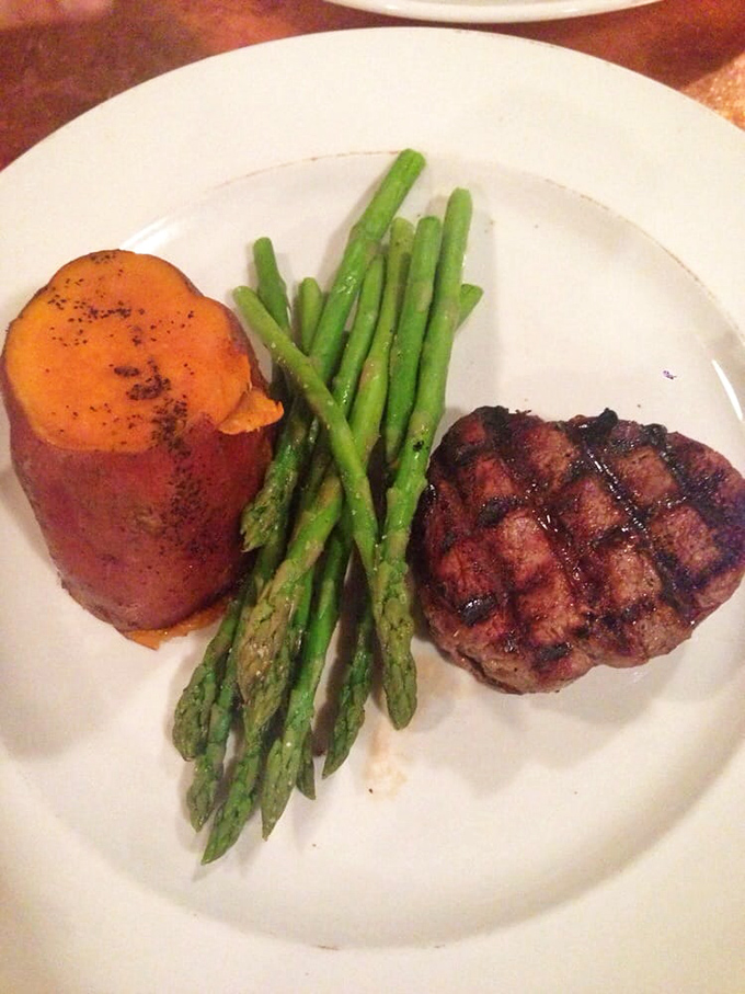 Buffalo tenderloin cooked to perfection, flanked by asparagus soldiers standing at attention. This plate doesn't just feed you—it respects you.