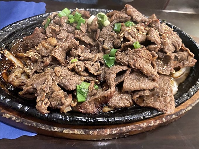 Sizzling bulgogi that's had a proper marinade introduction – the caramelized edges tell you everything you need to know about the kitchen's attention to detail.