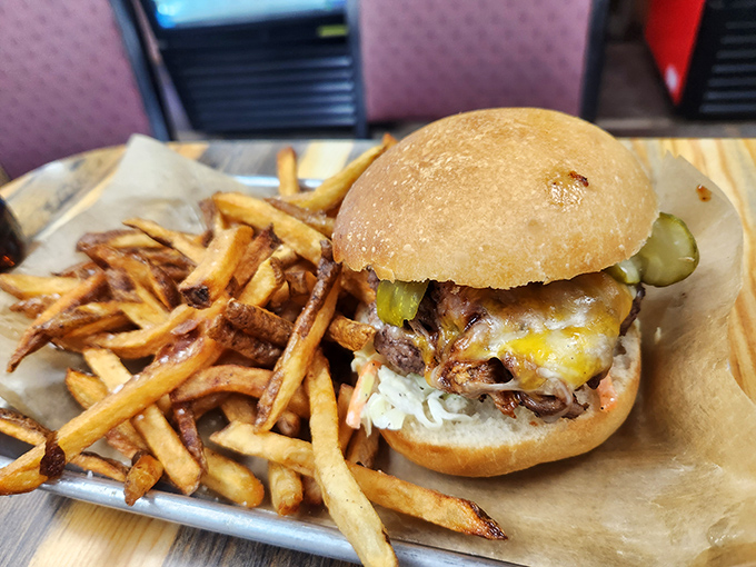 A burger that doesn't need fancy toppings or a clever name—just honest beef, melty cheese, and fries that demand to be devoured. 