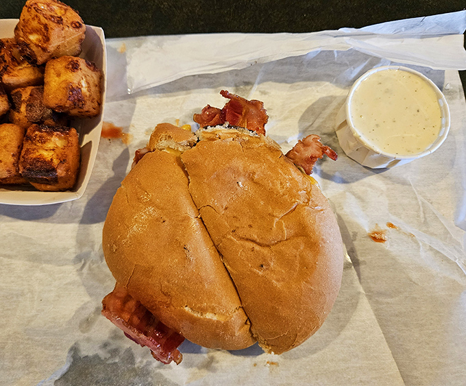 Behold the butter burger in its natural habitat—served on that distinctive hard roll with perfectly crispy hash browns that would make any Wisconsinite proud.