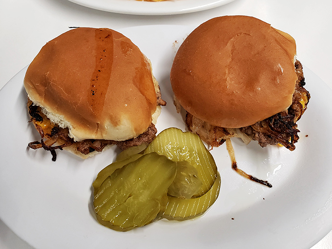These aren't your fancy $18 gastropub sliders—they're honest-to-goodness burgers with pickle chips that snap with each bite. No food stylist required.