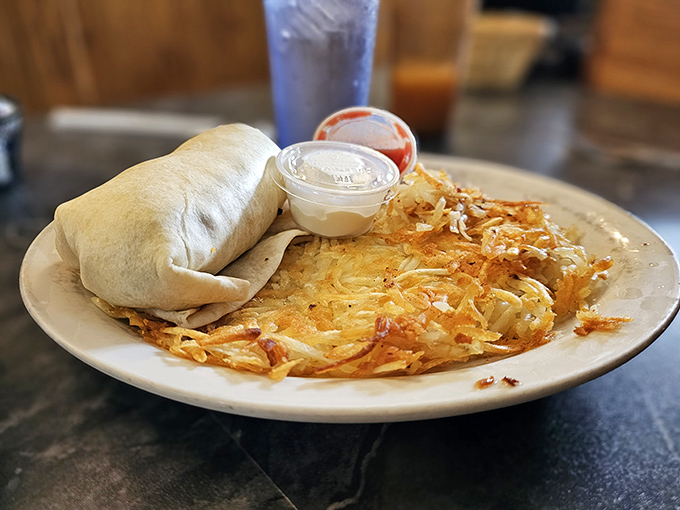 The breakfast burrito—where tortilla meets morning essentials in a hand-held masterpiece that makes you wonder why we bother with plates at all.