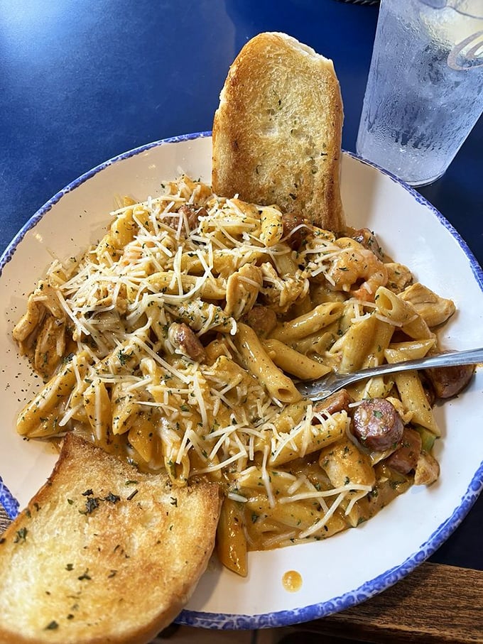 Pasta that's having an identity crisis in the best possible way—part Italian comfort, part Cajun kick, all delicious with generous chunks of sausage.