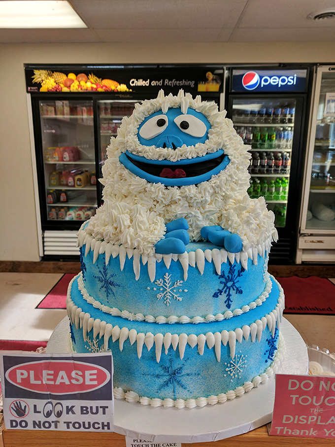 Not just any cake—an edible winter wonderland topped with the happiest abominable snowman you'll ever meet. Frosty would be jealous.