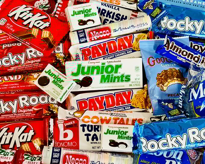 A candy bar mosaic that reads like a timeline of American history—each wrapper a chapter in our collective sweet tooth biography.