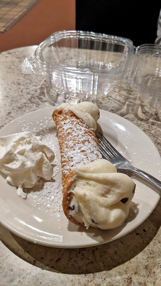 Meet the star of our show—a cannoli so perfect it deserves its own agent. That creamy filling with chocolate chips is the stuff dreams are made of.