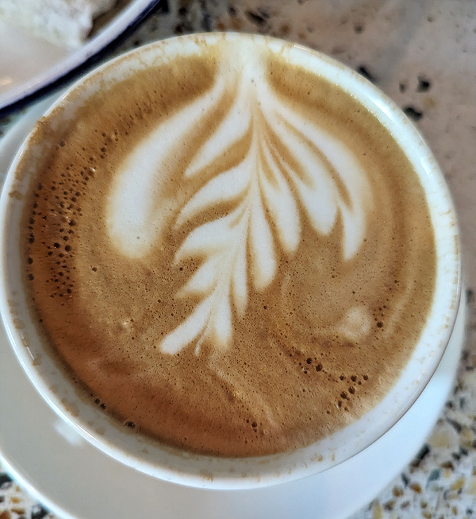 Coffee art that's almost too pretty to drink—almost. This velvety latte provides the perfect finale to a wood-fired feast.