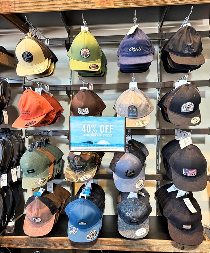 A wall of caps at 40% off—because nothing says "I'm fiscally responsible" like buying a hat that shields you from both sun and full retail prices.