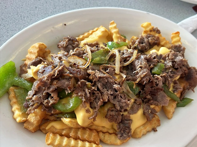 Cheese fries elevated to an art form—where crispy meets gooey meets savory in a dance of deliciousness that defies all diet plans.
