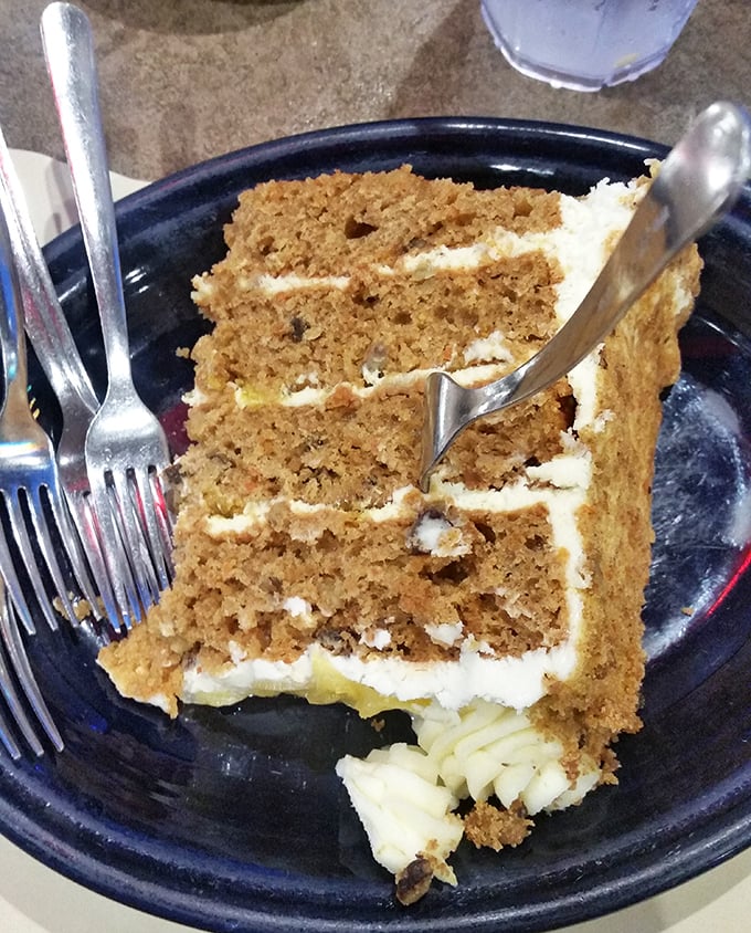 Layer upon layer of moist carrot cake with cream cheese frosting so thick you could practically use it as a pillow—sweet dreams indeed.