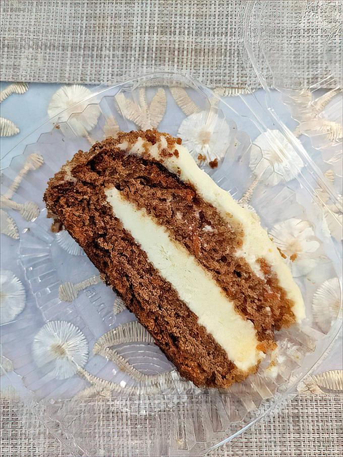 A slice of carrot cake that doesn't need a filter or a hashtag – just your undivided attention and possibly a moment of respectful silence.