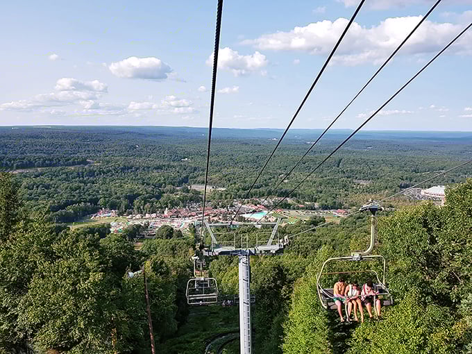 The chairlift ride up Camelback Mountain offers a preview of the spectacular views awaiting at Big Pocono, with forest canopy rolling beneath your dangling feet.