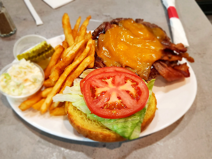 This isn't just a burger; it's architecture you can eat, where each layer from the melted cheese to the garden-fresh tomato plays its essential role.