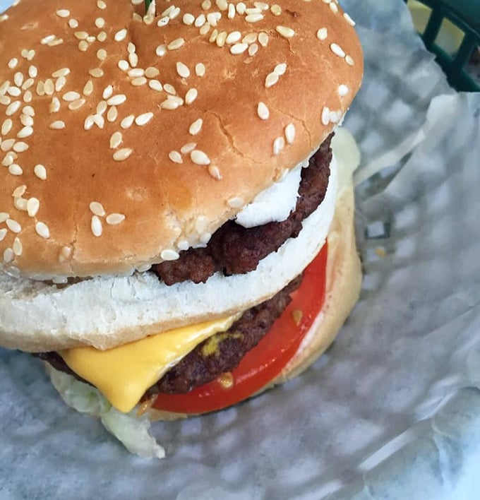 This isn't some fancy gastropub's "deconstructed burger experience"—it's the real deal, where sesame seeds and melty cheese create timeless magic.