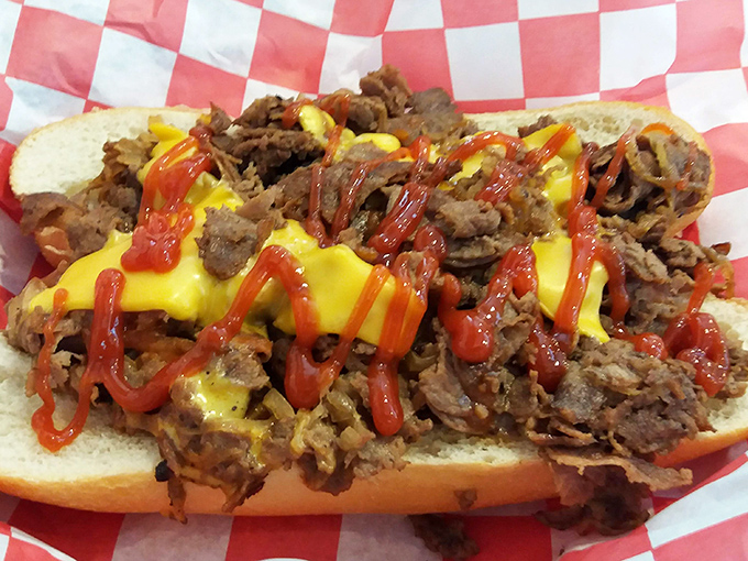 Behold the Beef BBQ sandwich—tender meat drizzled with cheese and sauce on a fresh roll. Napkins required, regrets impossible.