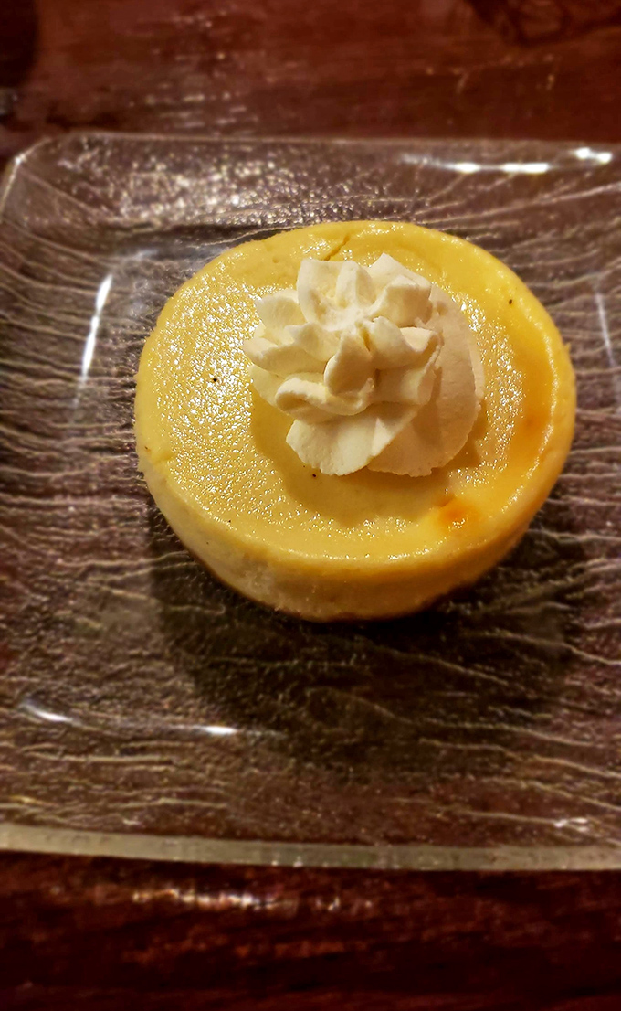 Silky smooth cheesecake that somehow manages to be both light and indulgent—the culinary equivalent of having your cake and eating it too.