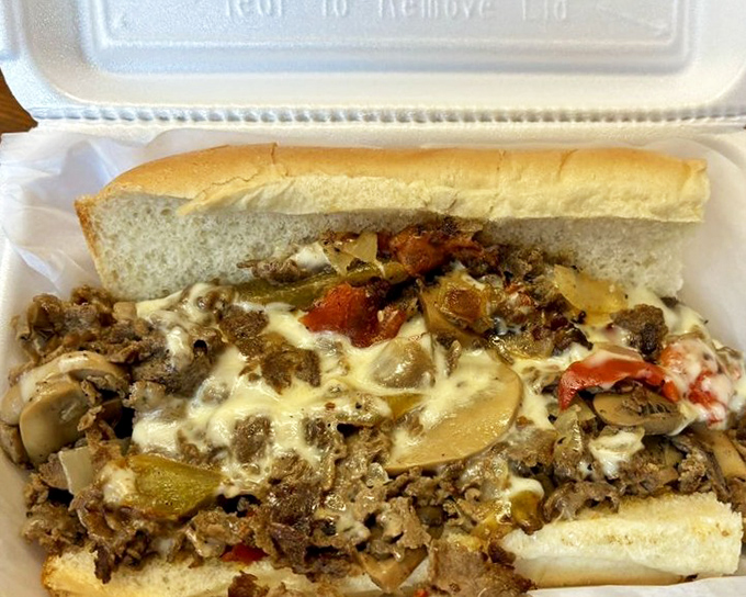 The Deluxe Cheesesteak: where Pennsylvania traditions meet barbecue expertise. Those peppers and mushrooms aren't just toppings—they're supporting actors in a meaty masterpiece.