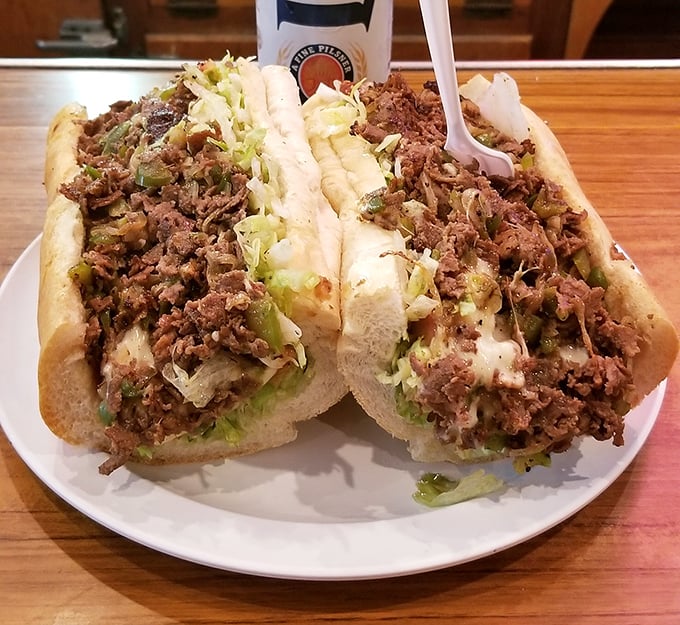 The cheesesteak doesn't mess around—a mountain of seasoned beef topped with enough cheese and veggies to make Philadelphia nervously look over its shoulder.