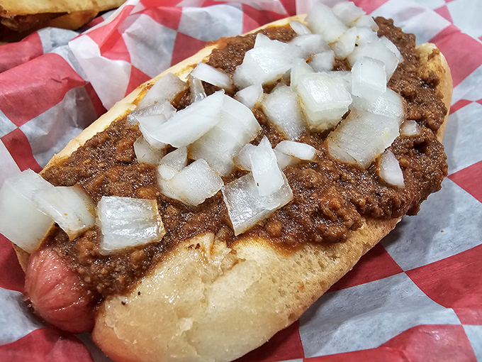 The star of the show: a chili dog that doesn't mess around. Those diced onions add the perfect crunch to complement the savory chili.