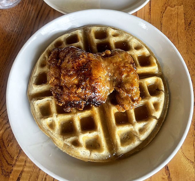Whoever decided fried chicken belongs on waffles deserves a Nobel Prize. This golden-brown masterpiece makes a compelling case.