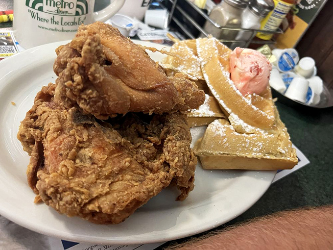 The holy grail of comfort food: golden-fried chicken with a waffle foundation and strawberry butter melting into every perfect pocket. This is why elastic waistbands were invented.