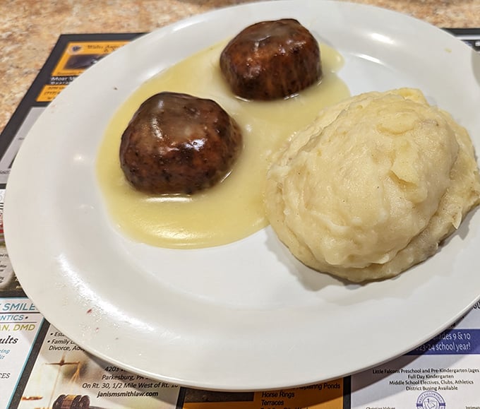 These meatballs aren't just sitting in sauce—they're luxuriating in it, like tiny meat islands in a golden gravy sea.