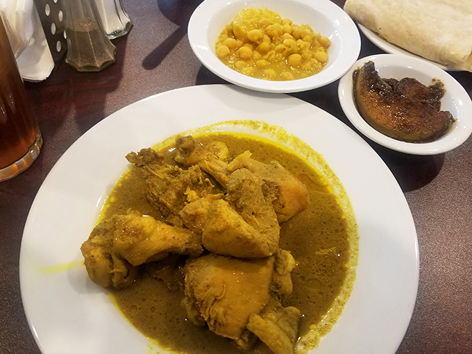 This curry chicken isn't just yellow – it's liquid sunshine. The sauce demands to be soaked up with every last grain of rice.