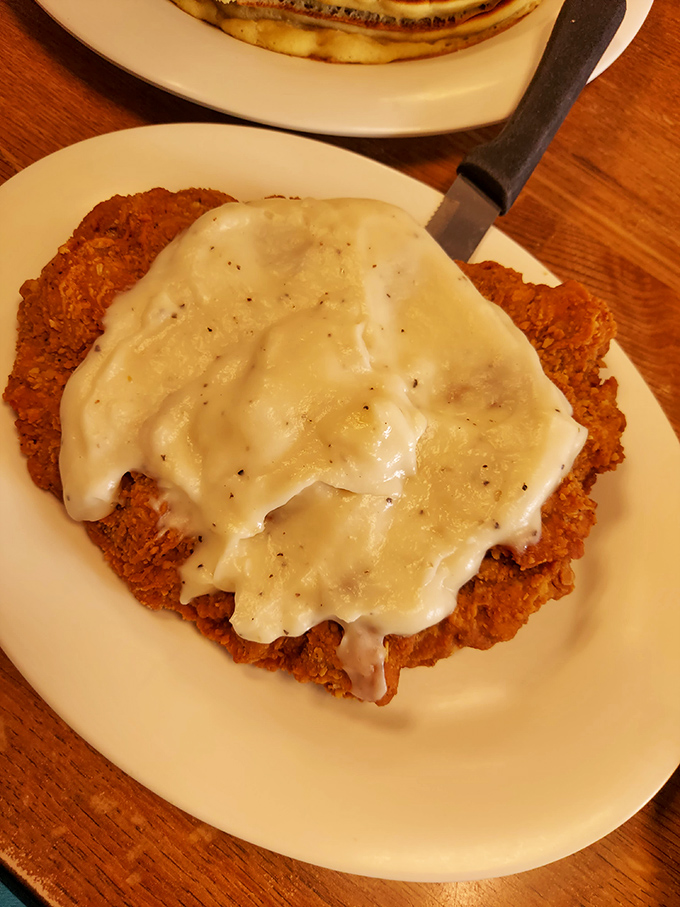 Chicken fried steak smothered in creamy gravy – where Southern comfort meets Virginia Beach in a dish that hugs your soul from the inside.