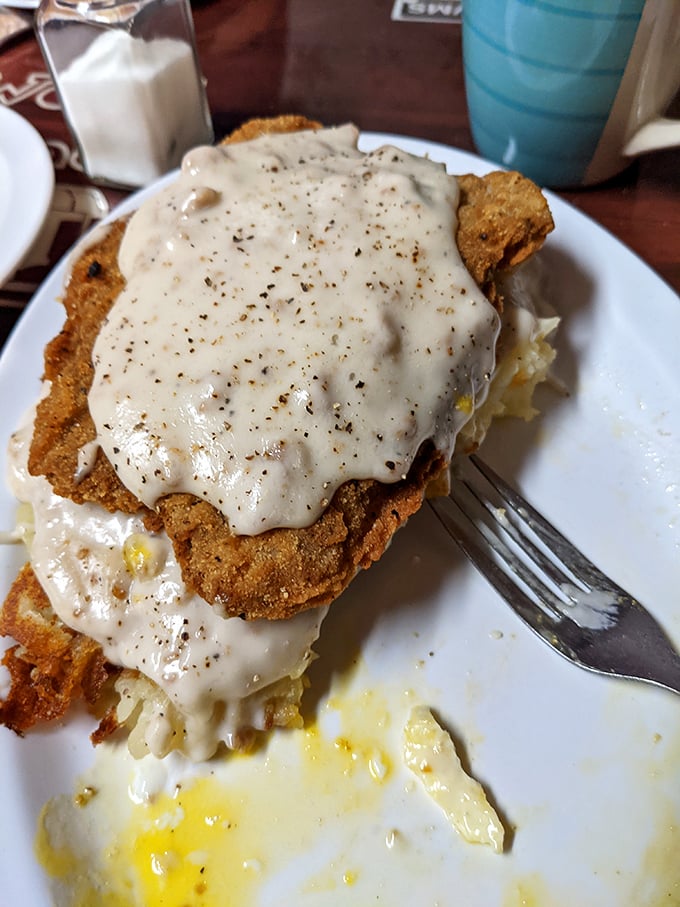 Chicken fried steak swimming in peppery gravy isn't diet food—it's soul food. The kind that makes you want to hug the cook and take a nap immediately afterward.