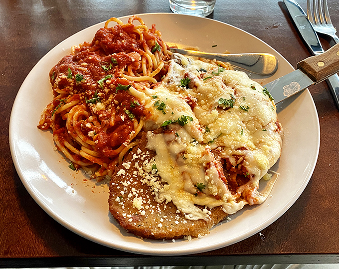 The chicken parmesan that launched a thousand cravings—golden, bubbling cheese meets bright tomato sauce in perfect harmony.