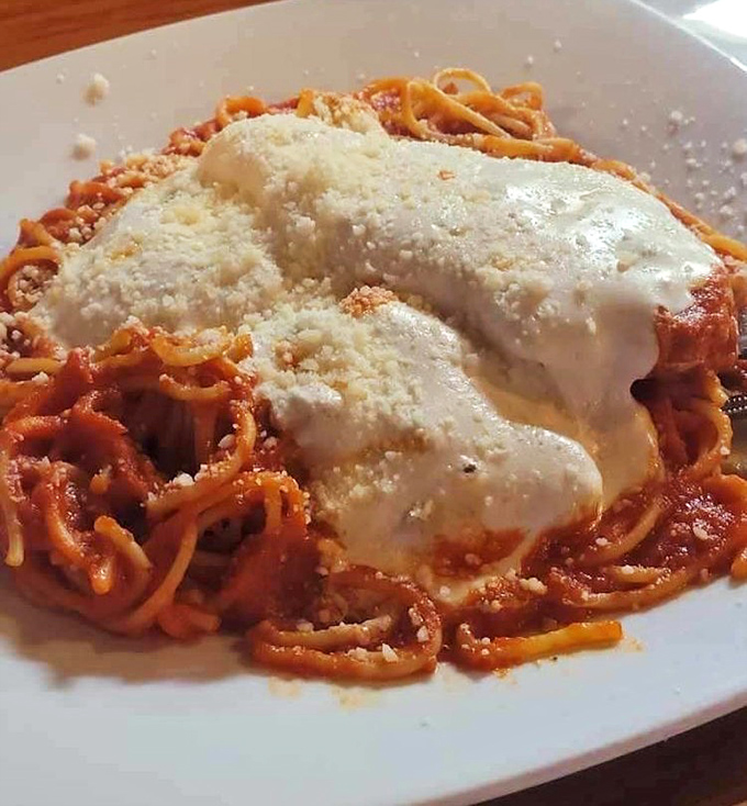 Chicken Parmigiana that would make your Italian grandmother weep with joy—if she could see past the mountain of melted cheese.