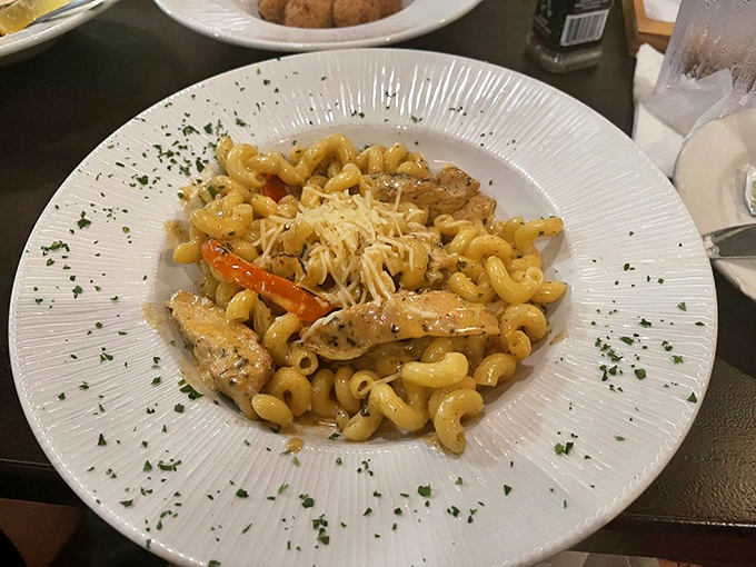 Pasta perfection with a coastal twist – tender cavatappi cradles succulent shrimp and chicken in a sauce worth sopping up with every last bread crumb.