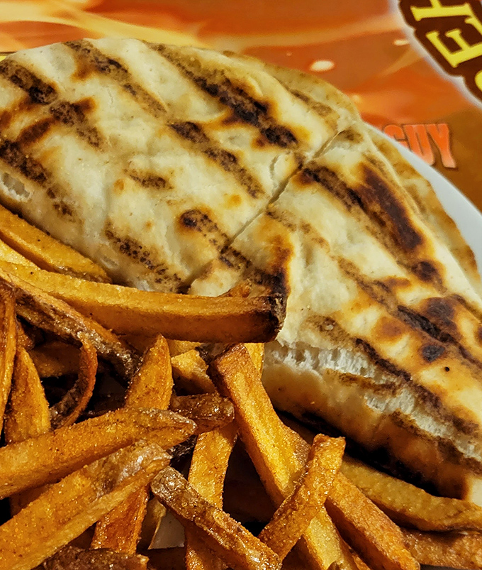 This isn't just any quesadilla – it's a perfectly grilled handheld treasure with golden grill marks that promise the ideal cheese-to-tortilla ratio.
