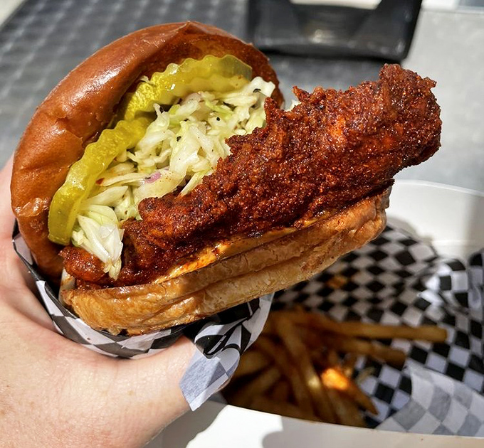 
The sandwich that launched a thousand road trips: perfectly fried chicken, vibrant slaw, and pickles on a soft bun—architecture that deserves its own blueprint. 